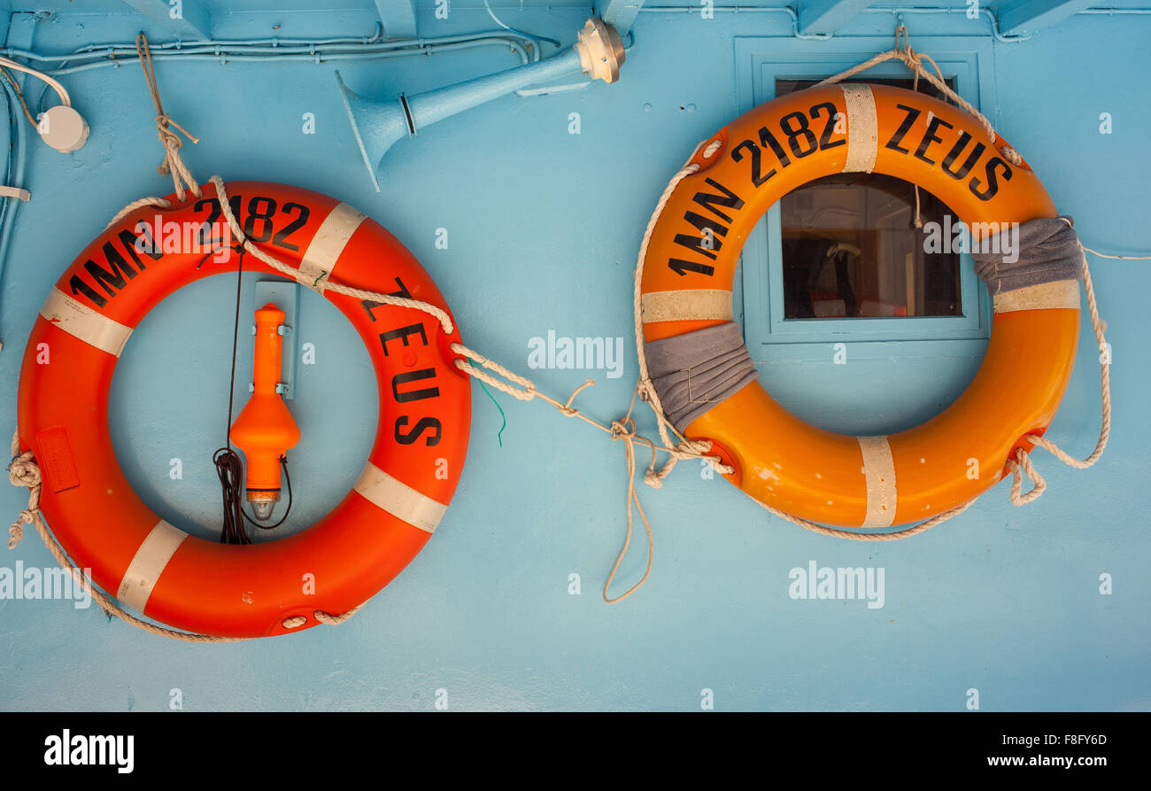 View of two lifebuoy on fisher boat Stock Photo - Alamy