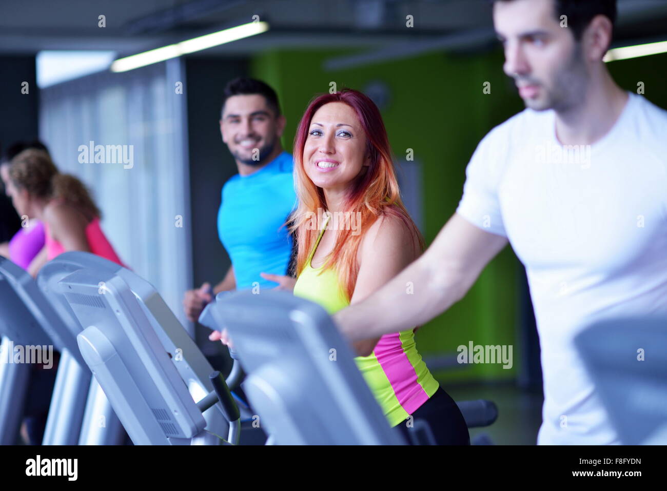 group of young people running on treadmills in modern sport gym Stock ...