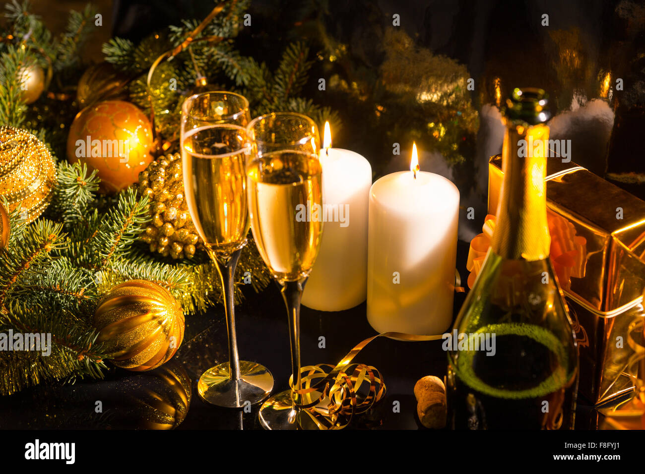 Festive champagne Christmas background with baubles, pine branches ...