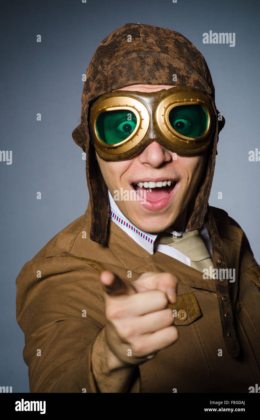 Funny pilot with goggles and helmet Stock Photo - Alamy