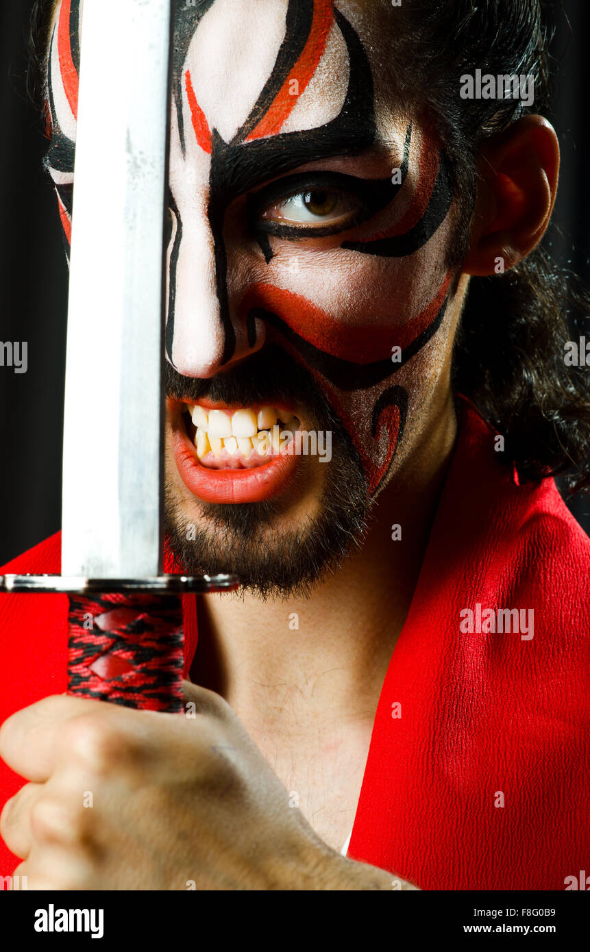 Man with sword and face mask Stock Photo - Alamy