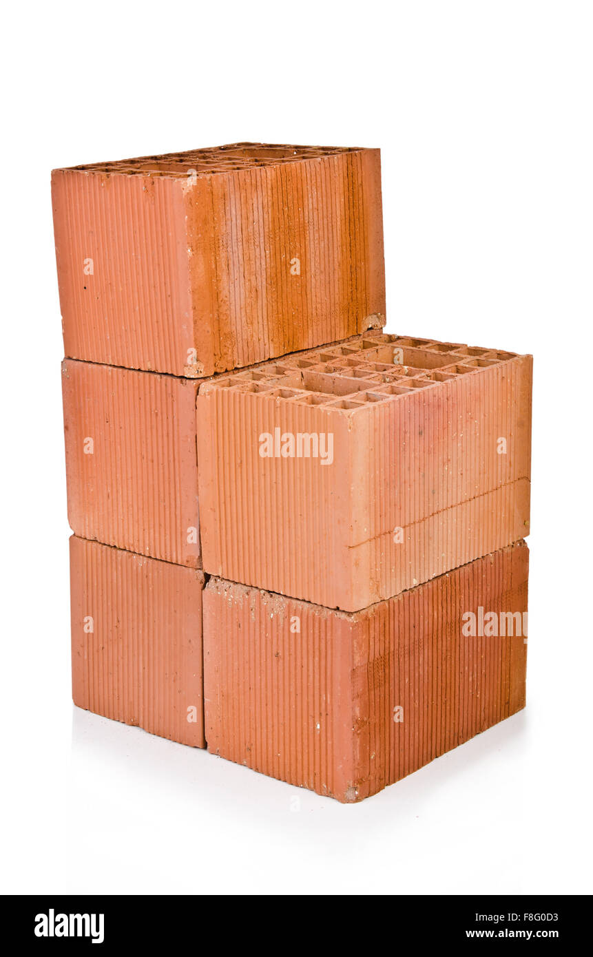 Stack of clay bricks isolated on white Stock Photo - Alamy
