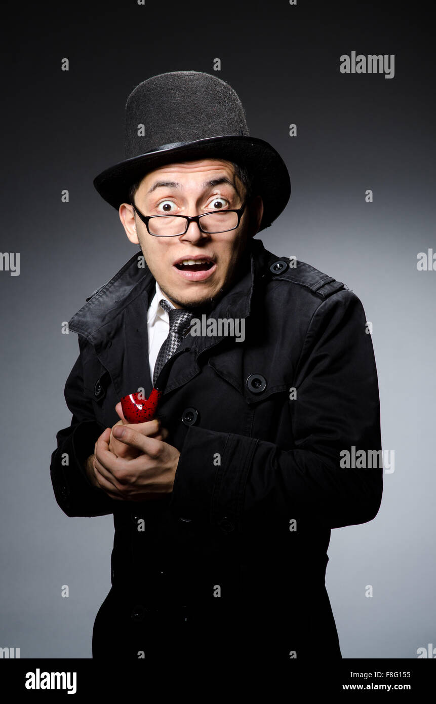 Funny detective with pipe and hat Stock Photo - Alamy