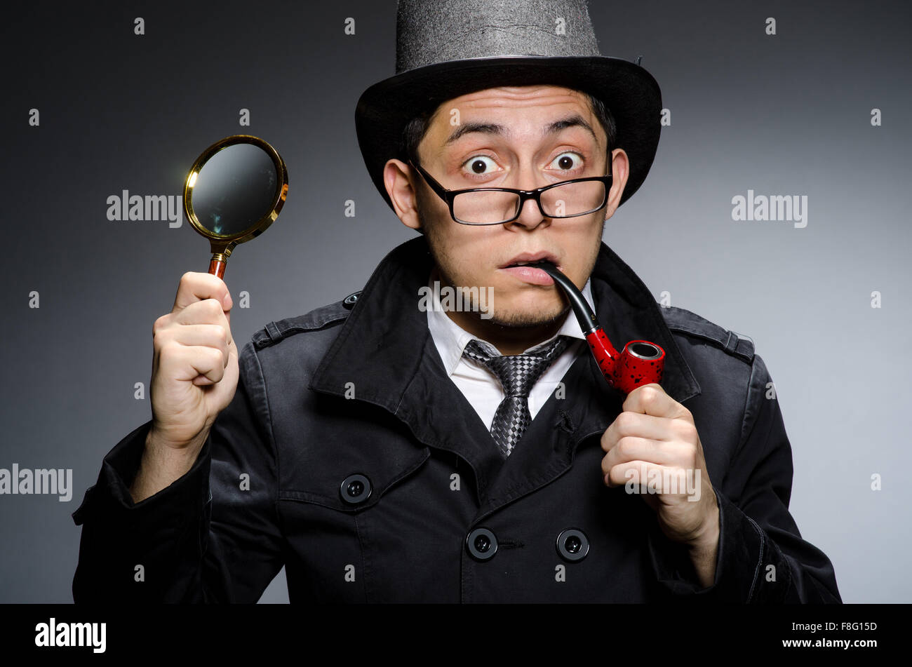 Funny detective with pipe and hat Stock Photo - Alamy