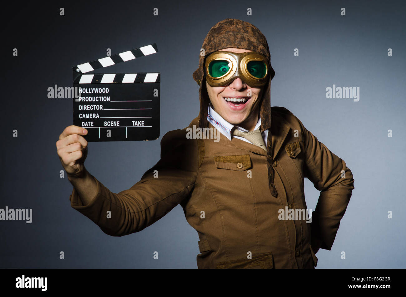 Funny pilot with goggles and helmet Stock Photo - Alamy