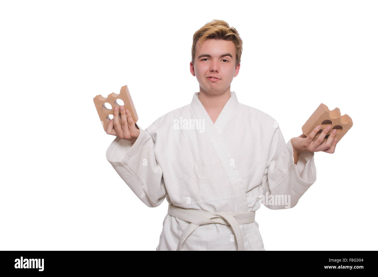 Funny karate man breaking bricks isolated on white Stock Photo - Alamy