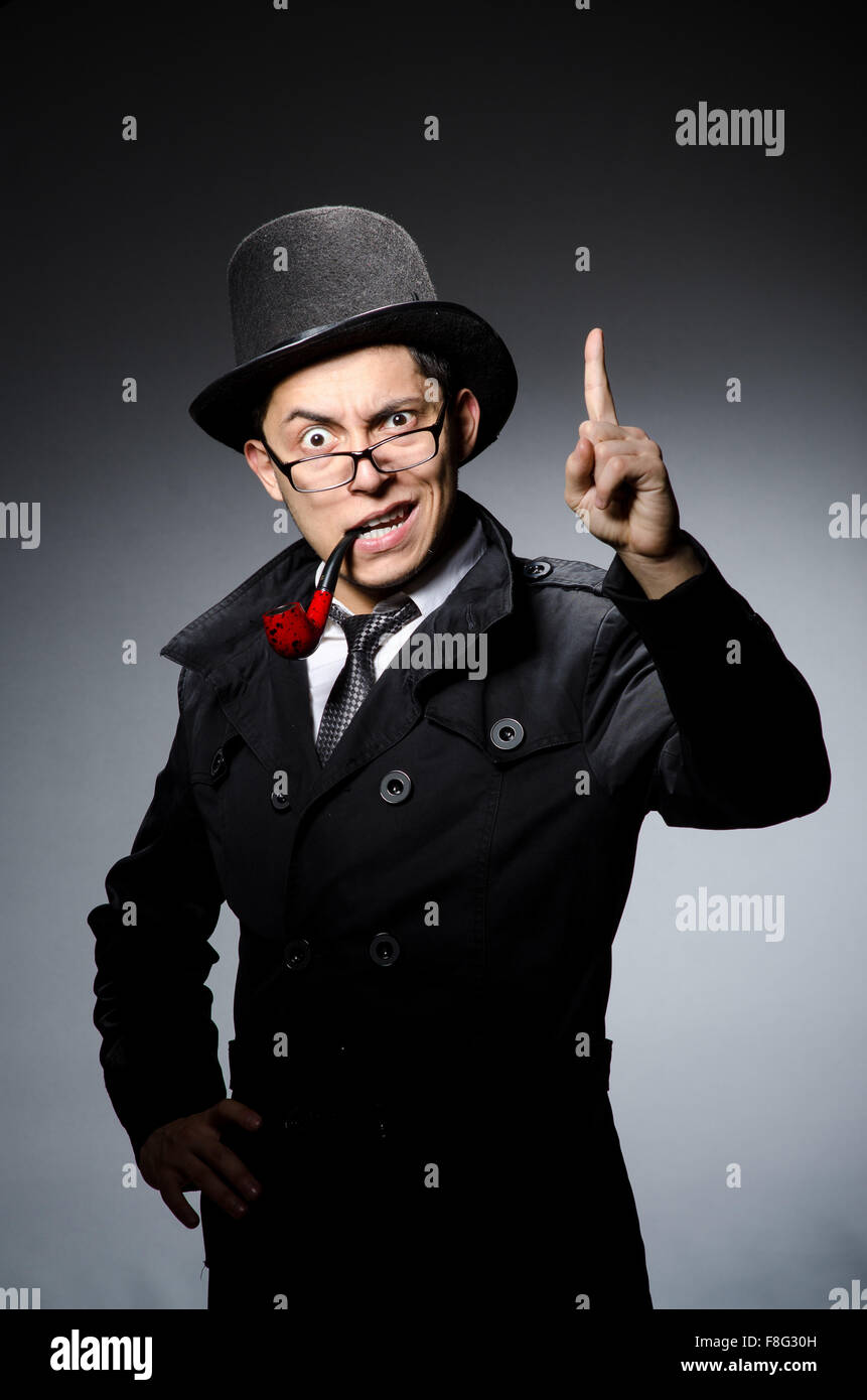 Funny detective with pipe and hat Stock Photo - Alamy