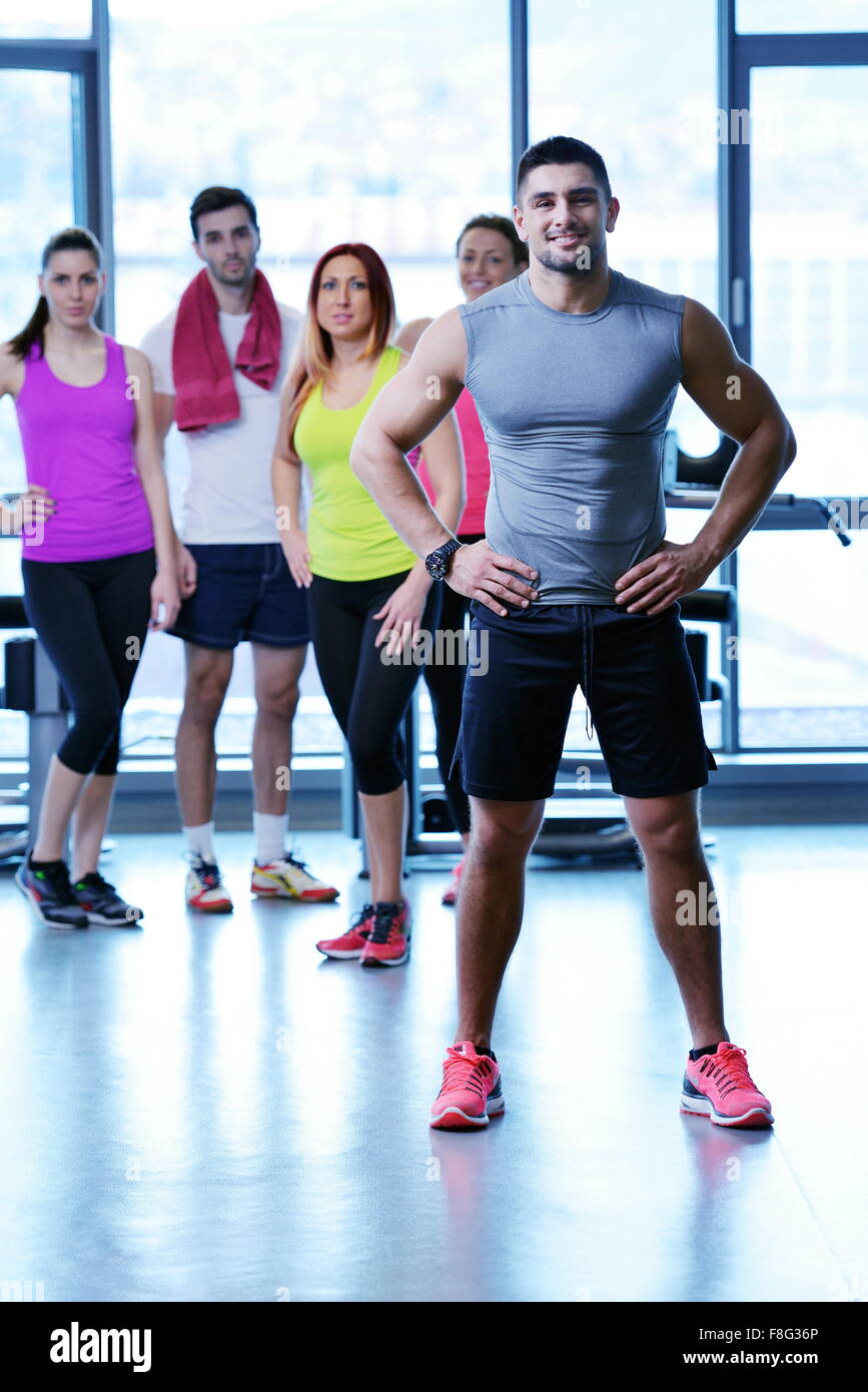 Group of people exercising at the gym and stretching Stock Photo - Alamy