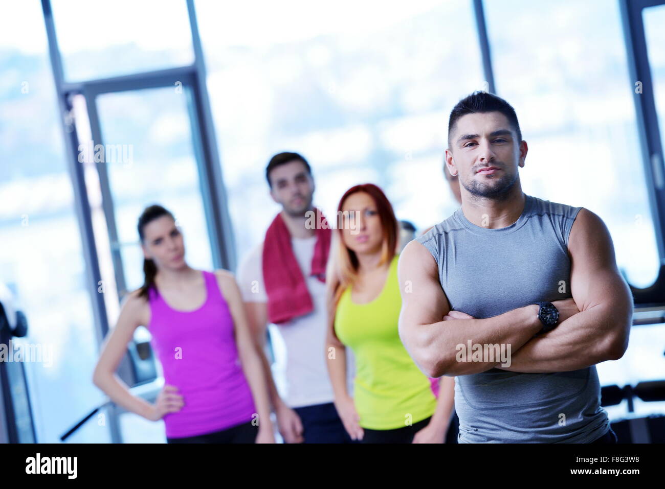 Group of people exercising at the gym and stretching Stock Photo - Alamy