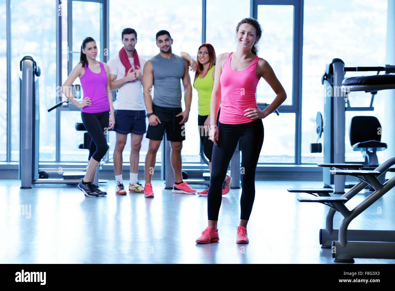 Group of people exercising at the gym and stretching Stock Photo - Alamy