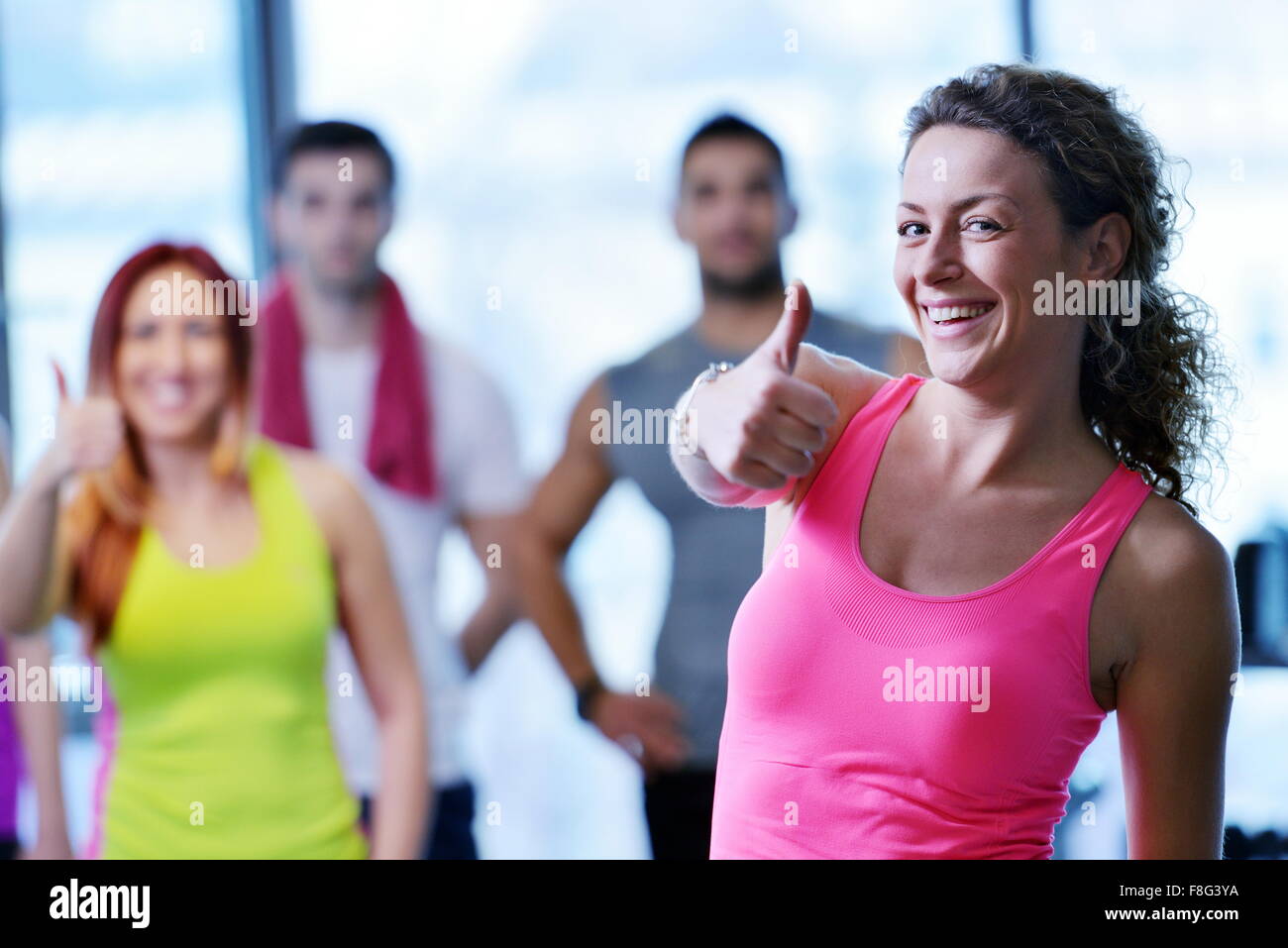 Group of people exercising at the gym and stretching Stock Photo - Alamy
