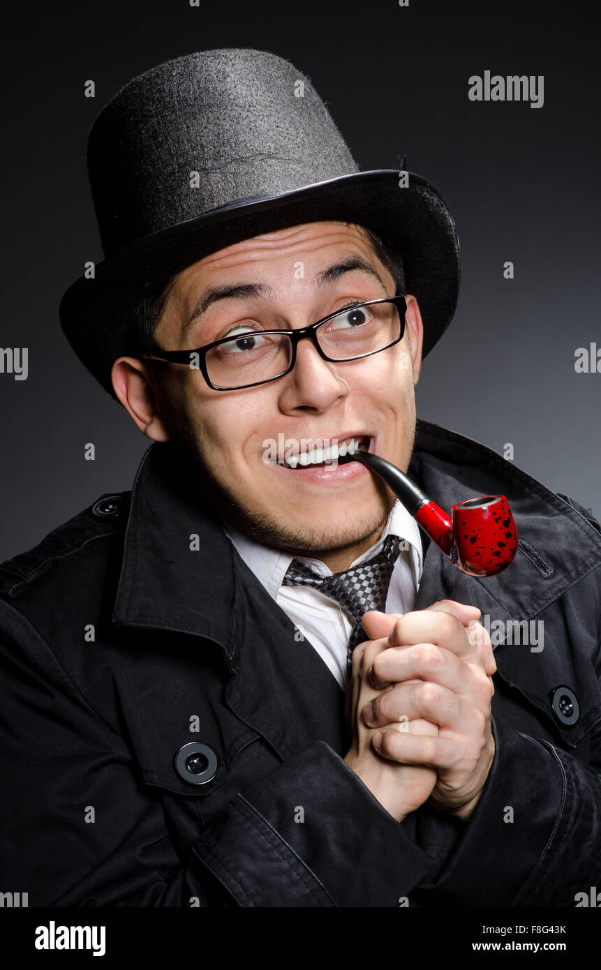 Funny detective with pipe and hat Stock Photo - Alamy