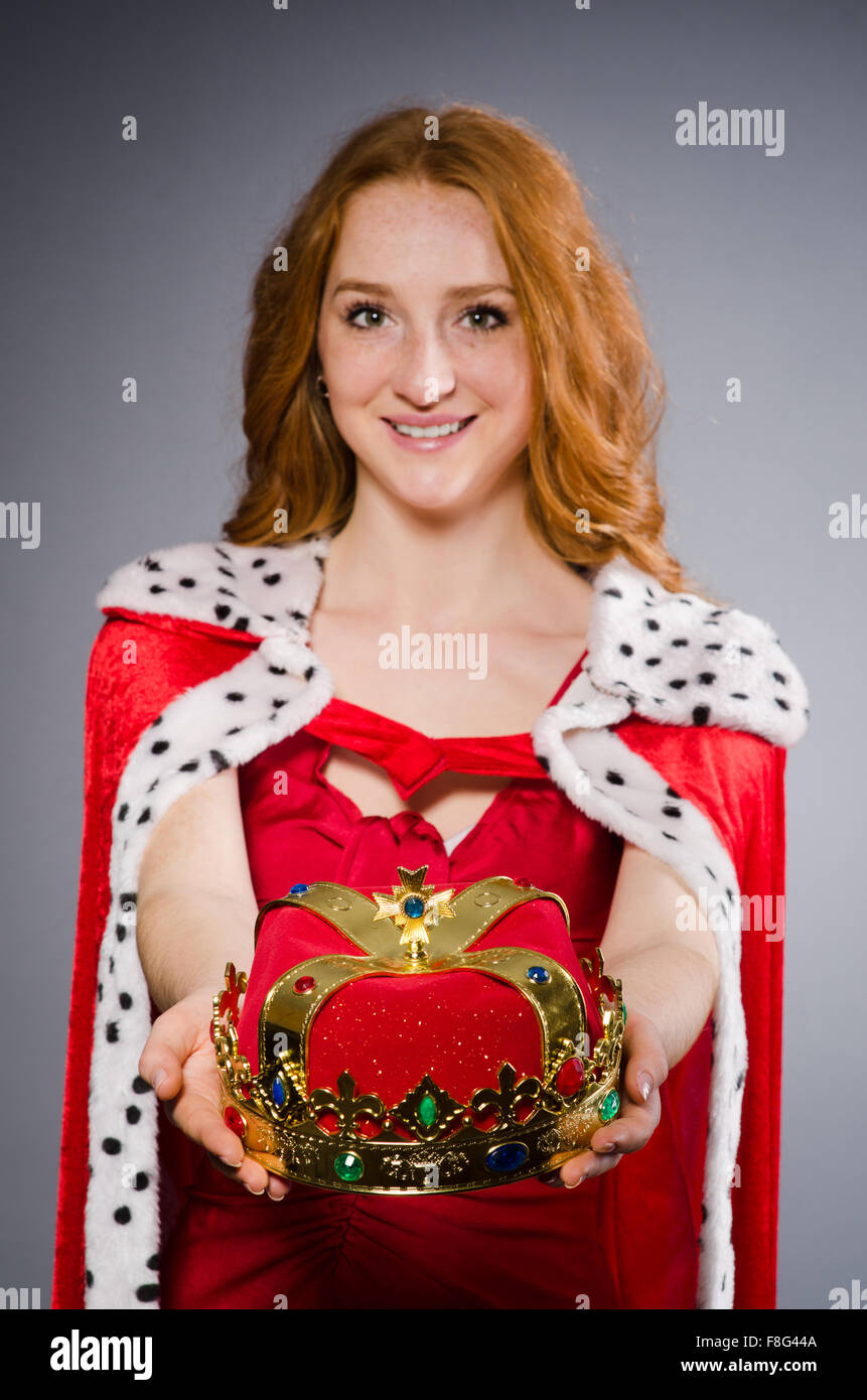 Queen in red dress in studio Stock Photo - Alamy