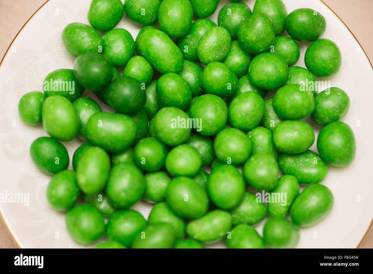 Green sweets as a background Stock Photo - Alamy
