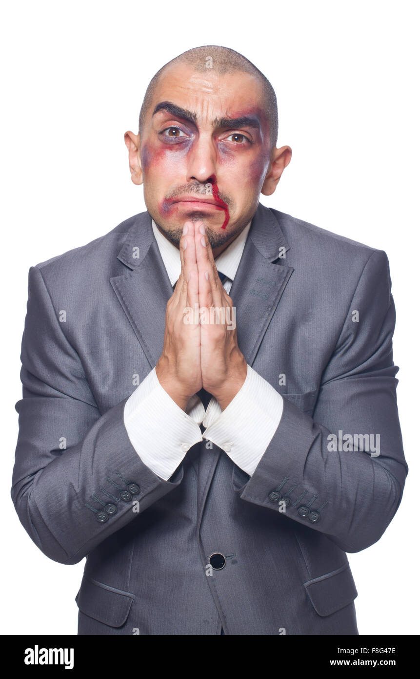 Badly beaten businessman isolated on white Stock Photo - Alamy