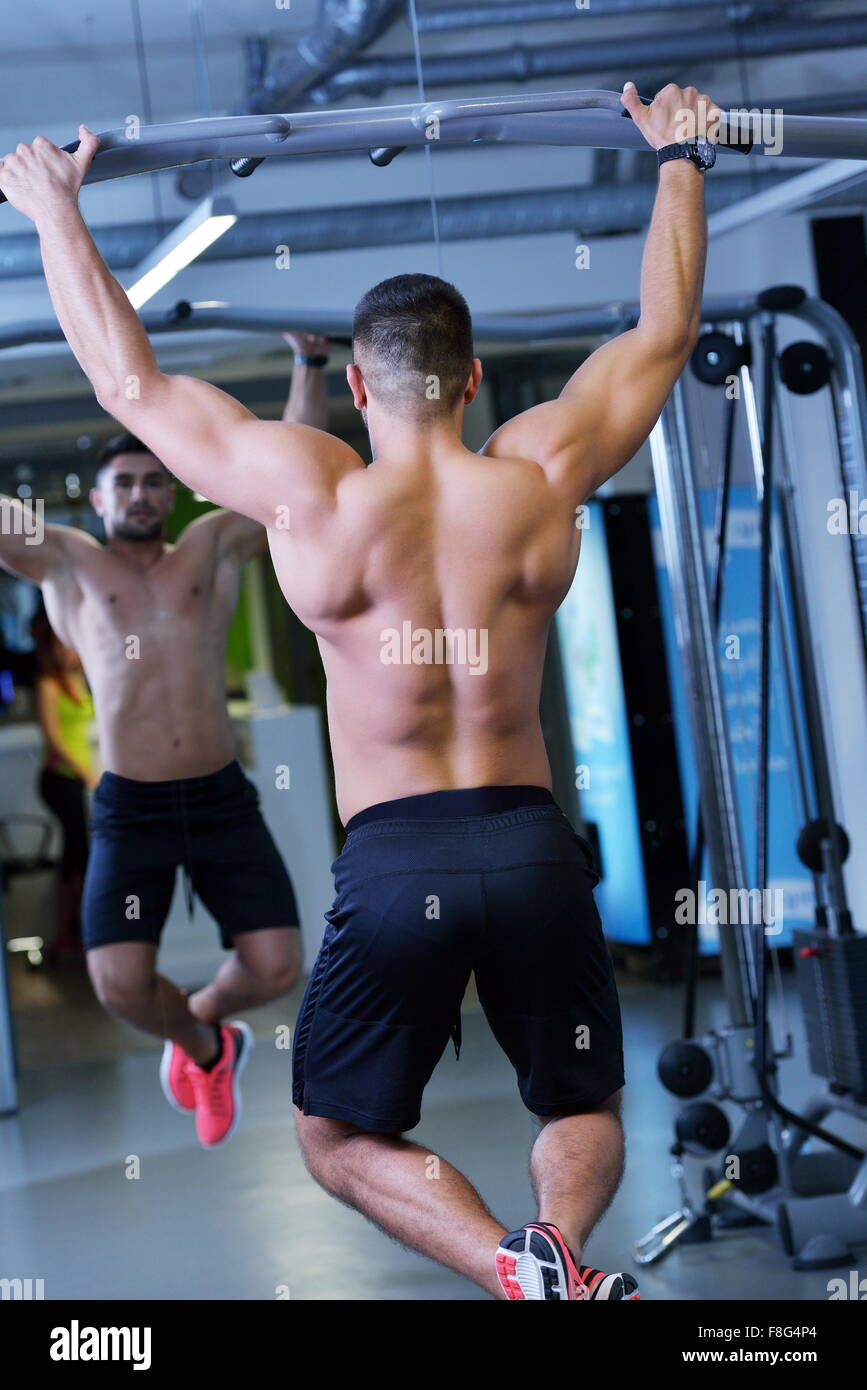 Strong handsome man exercising at the gym Stock Photo - Alamy