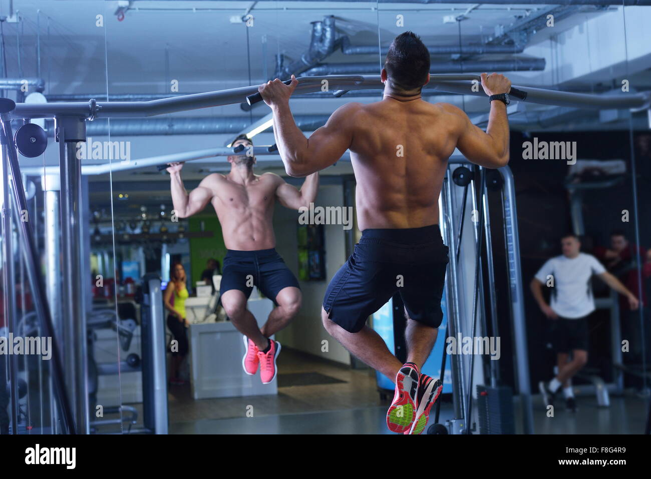 Strong handsome man exercising at the gym Stock Photo - Alamy
