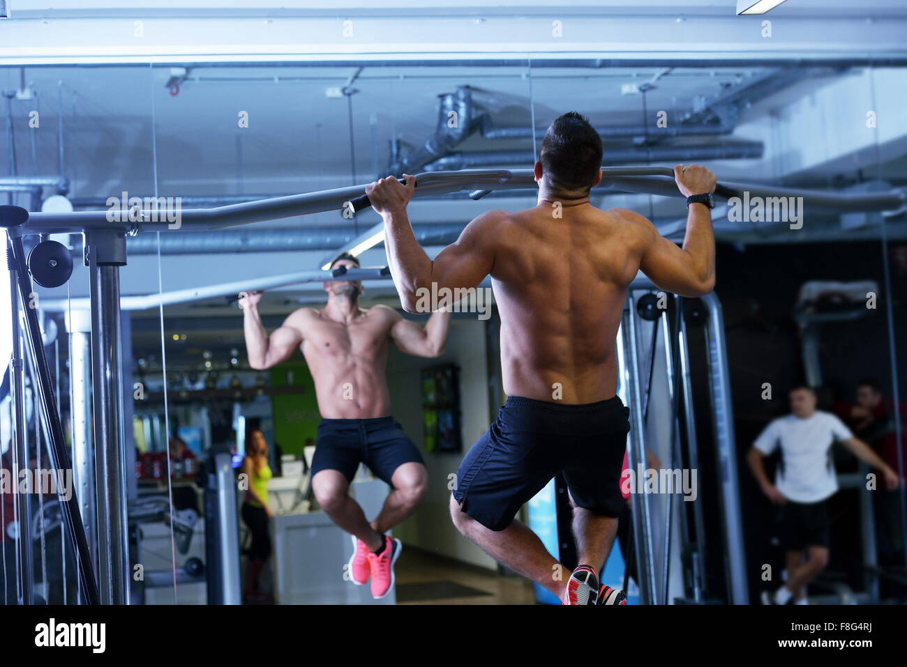 Strong handsome man exercising at the gym Stock Photo - Alamy