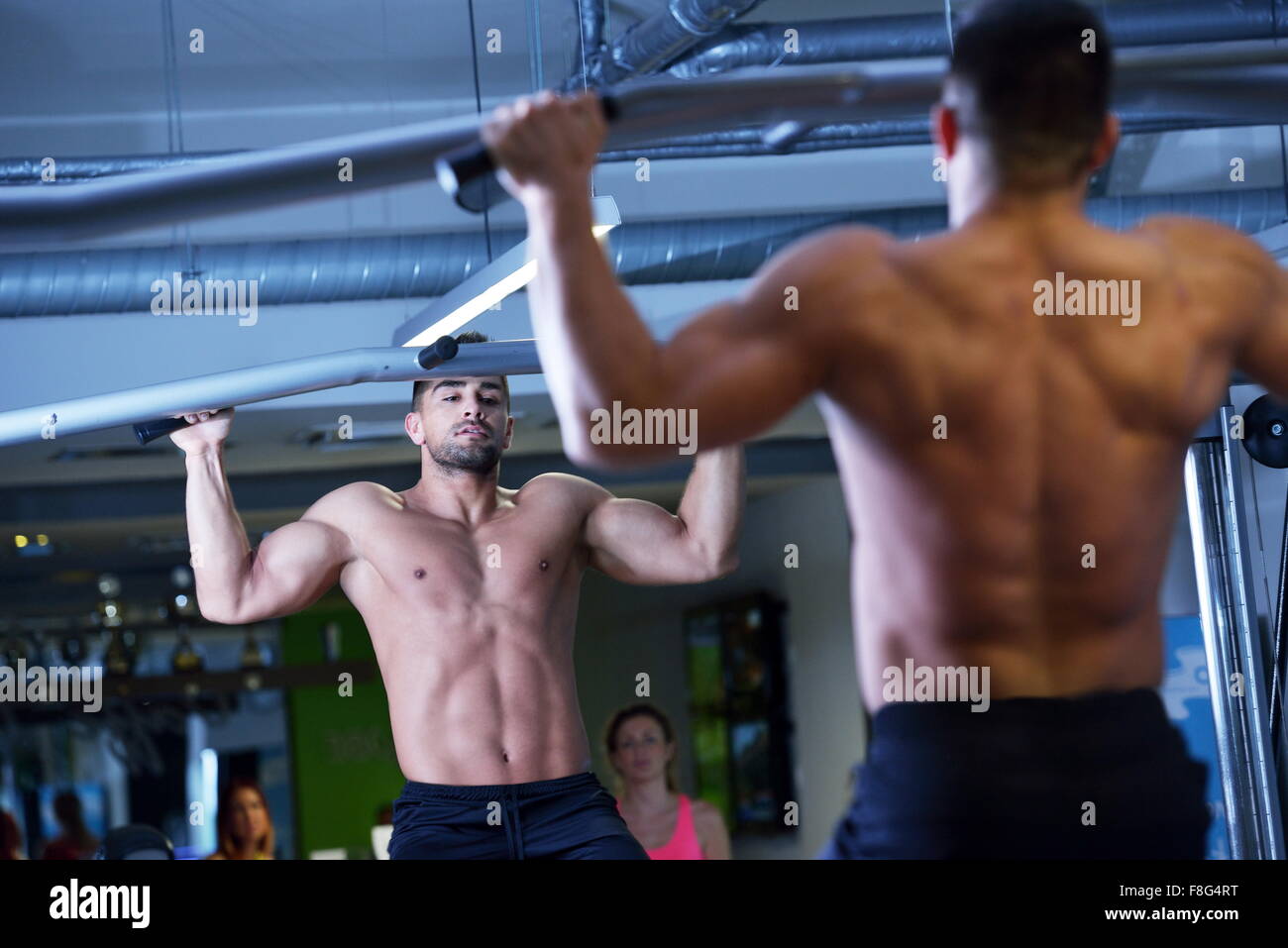 Strong handsome man exercising at the gym Stock Photo - Alamy
