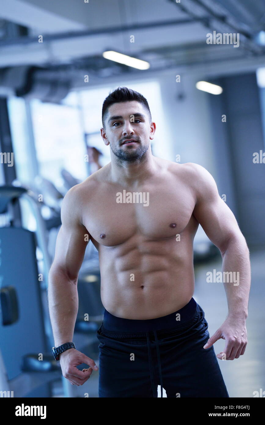 Strong handsome man exercising at the gym Stock Photo - Alamy