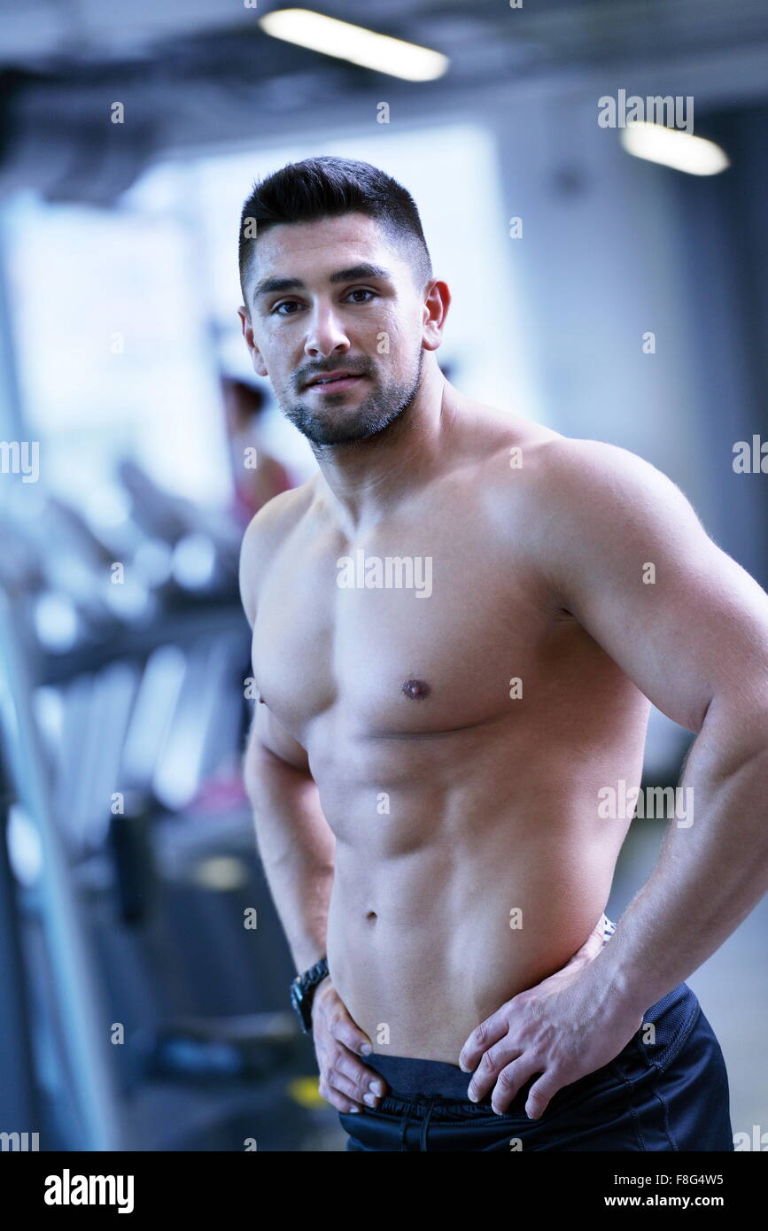 Strong handsome man exercising at the gym Stock Photo - Alamy
