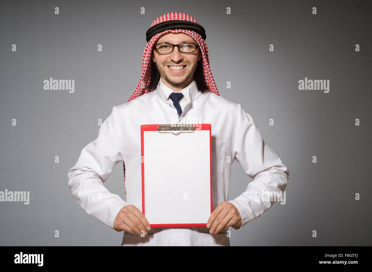 Arab man with paper binder Stock Photo - Alamy