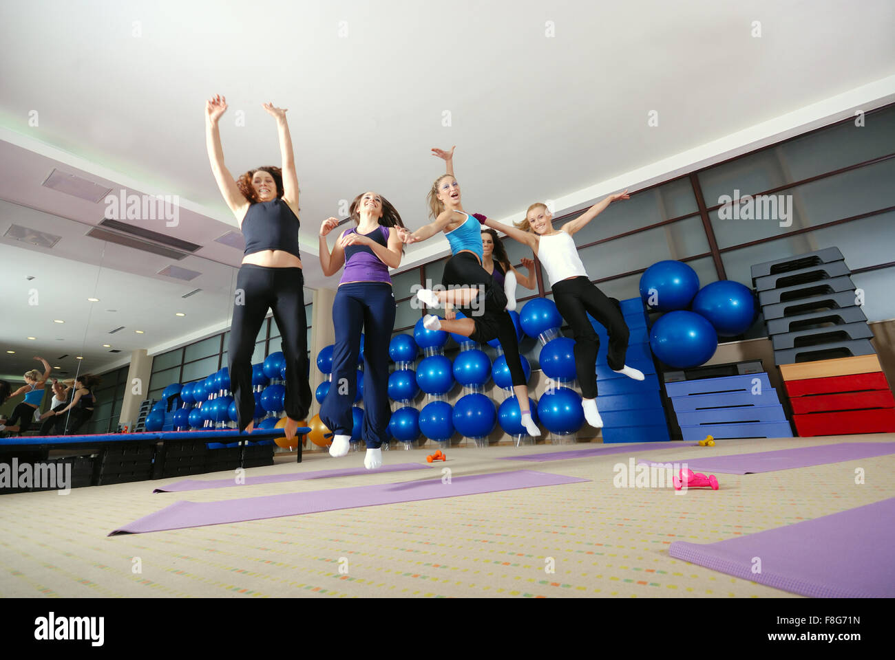 Happy young girls jumping high Stock Photo - Alamy