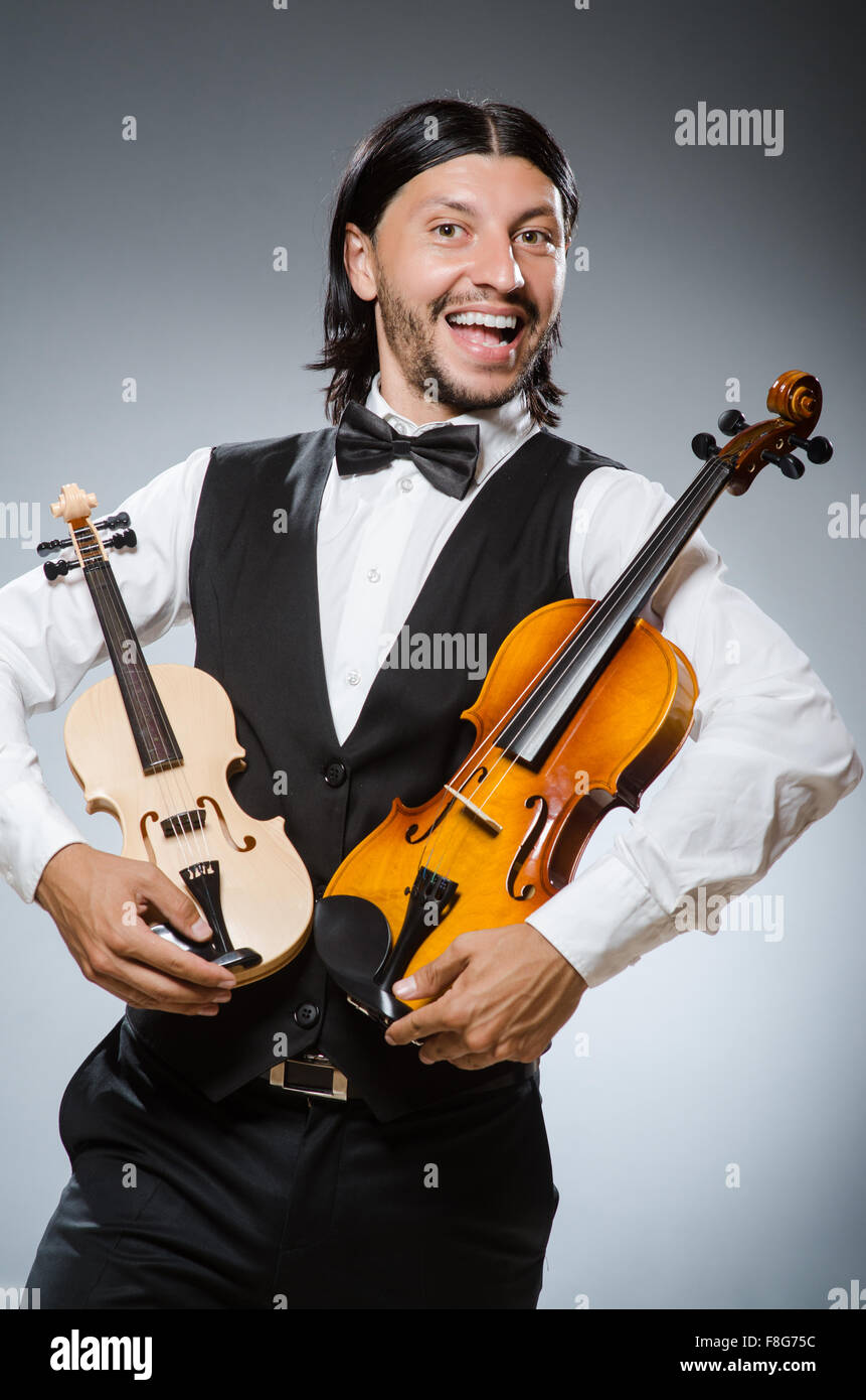 Funny fiddle violin player in musical concept Stock Photo - Alamy