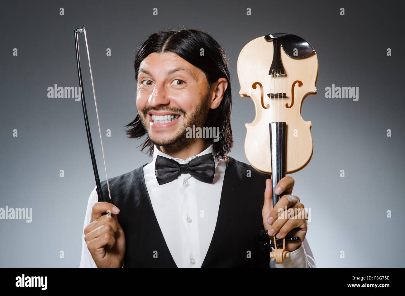 Funny fiddle violin player in musical concept Stock Photo - Alamy