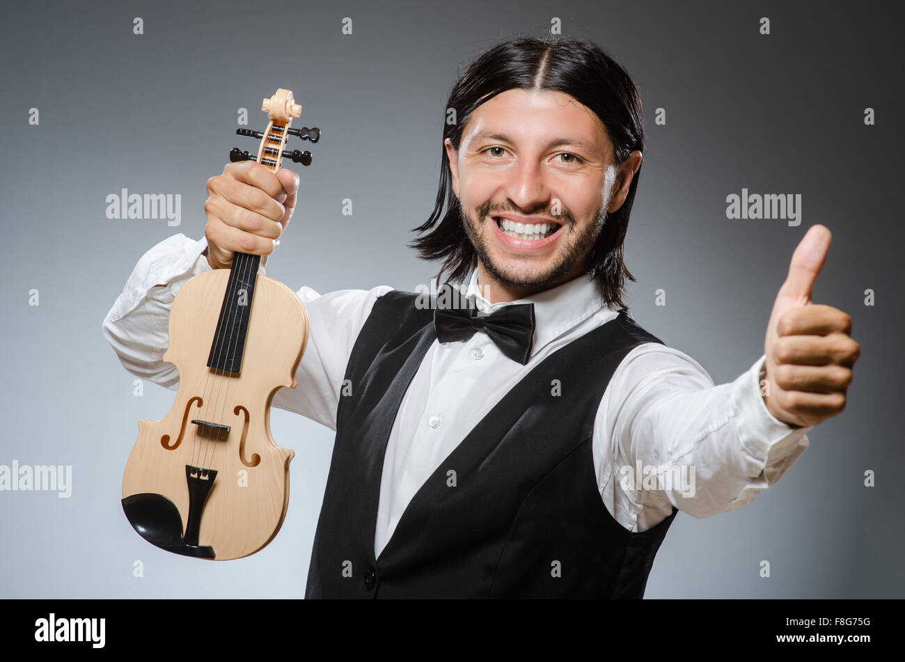 Funny fiddle violin player in musical concept Stock Photo - Alamy