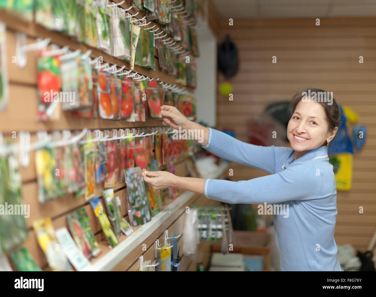 Woman chooses seeds store hi-res stock photography and images - Alamy