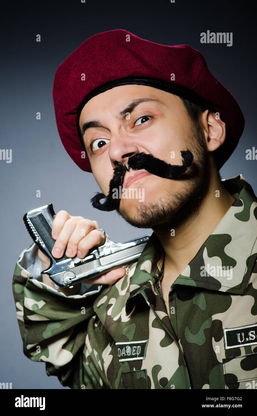 Funny soldier against the dark background Stock Photo - Alamy