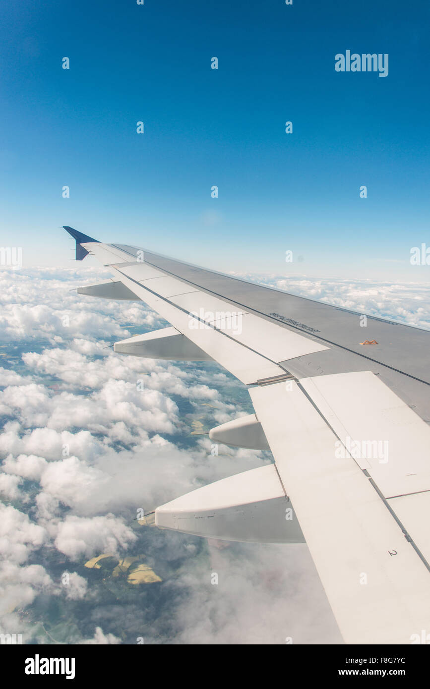 Airplane wing out of window Stock Photo - Alamy