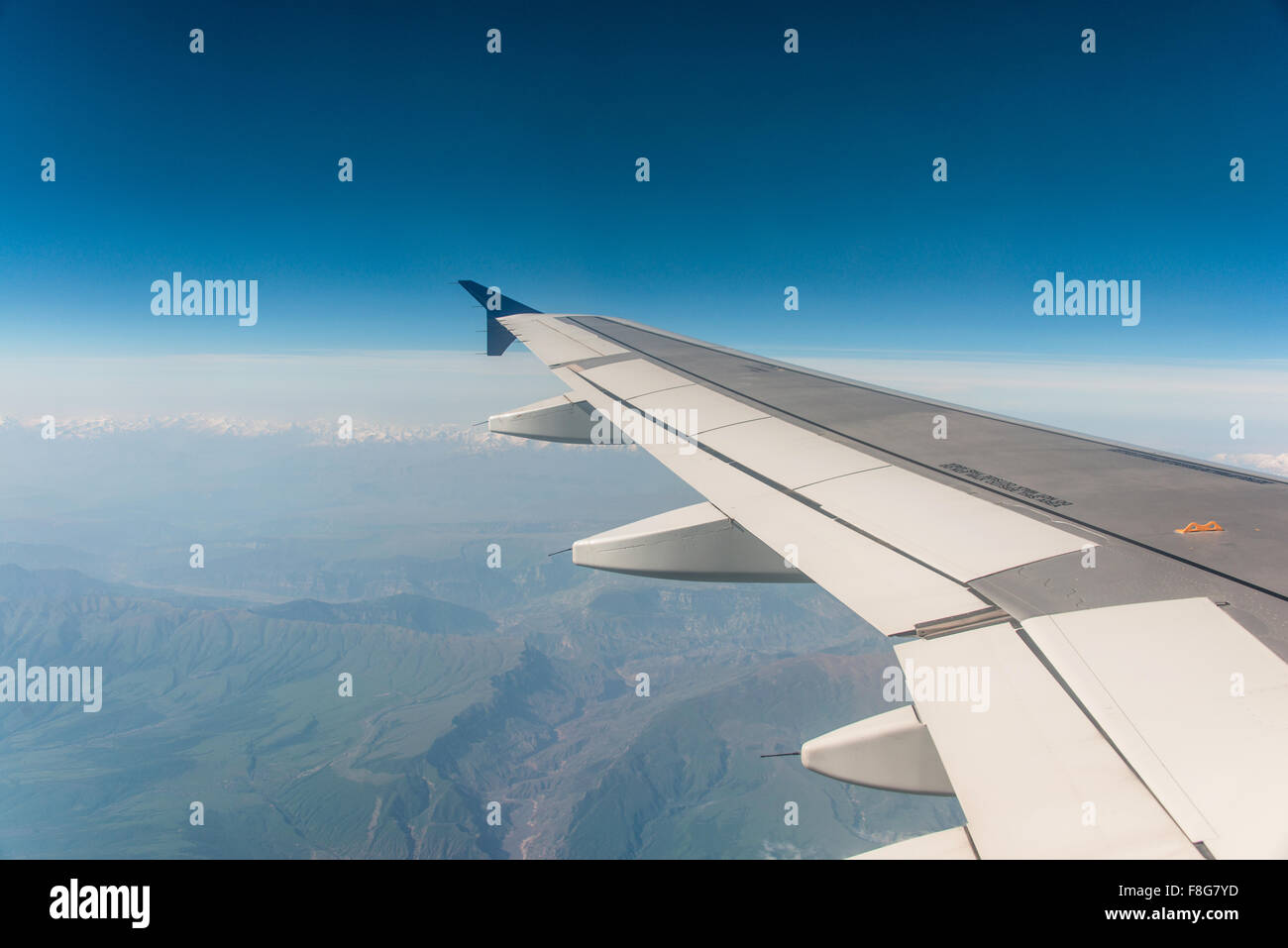 Airplane wing out of window Stock Photo - Alamy