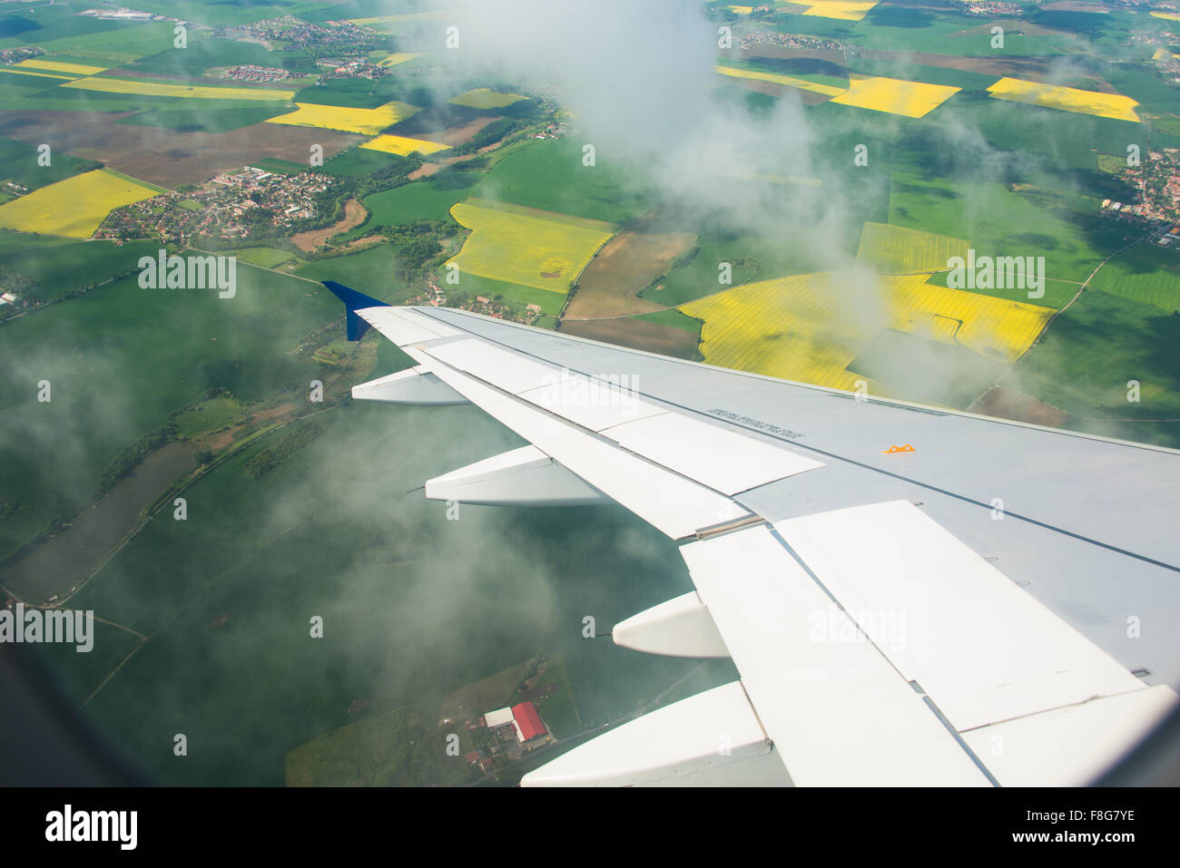 Airplane wing out of window Stock Photo - Alamy