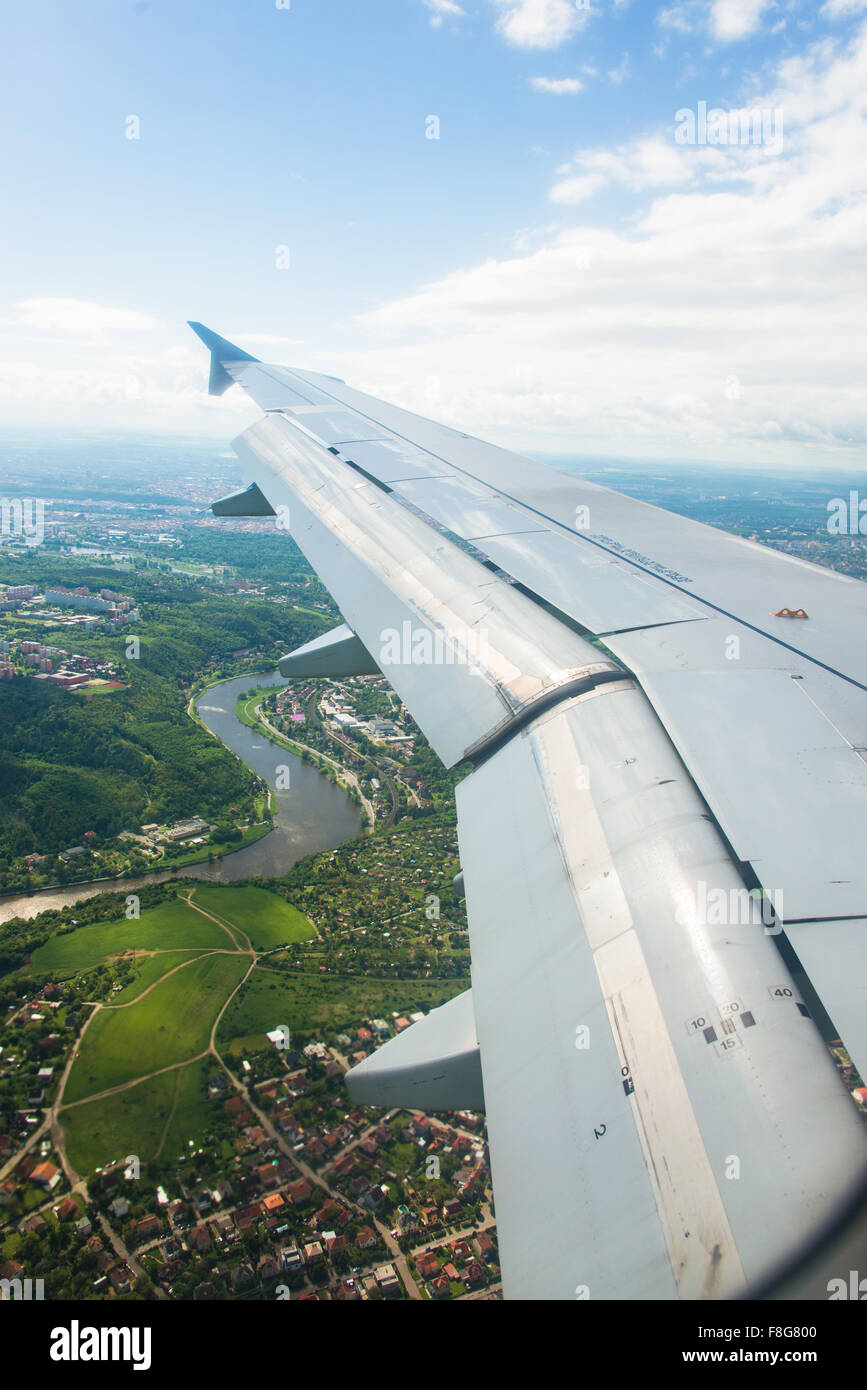Airplane wing out of window Stock Photo - Alamy