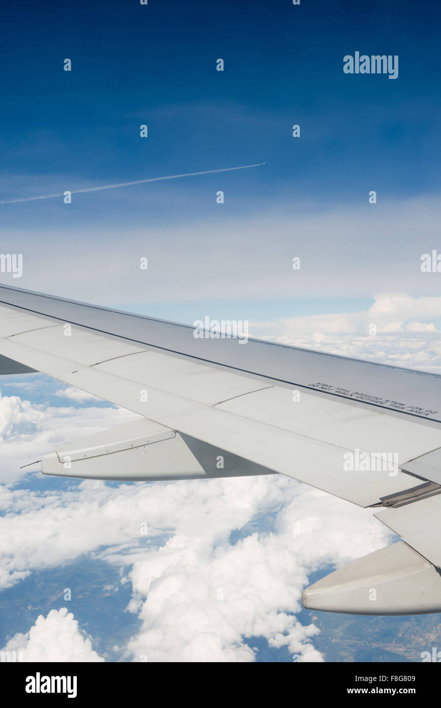 Airplane wing out of window Stock Photo - Alamy