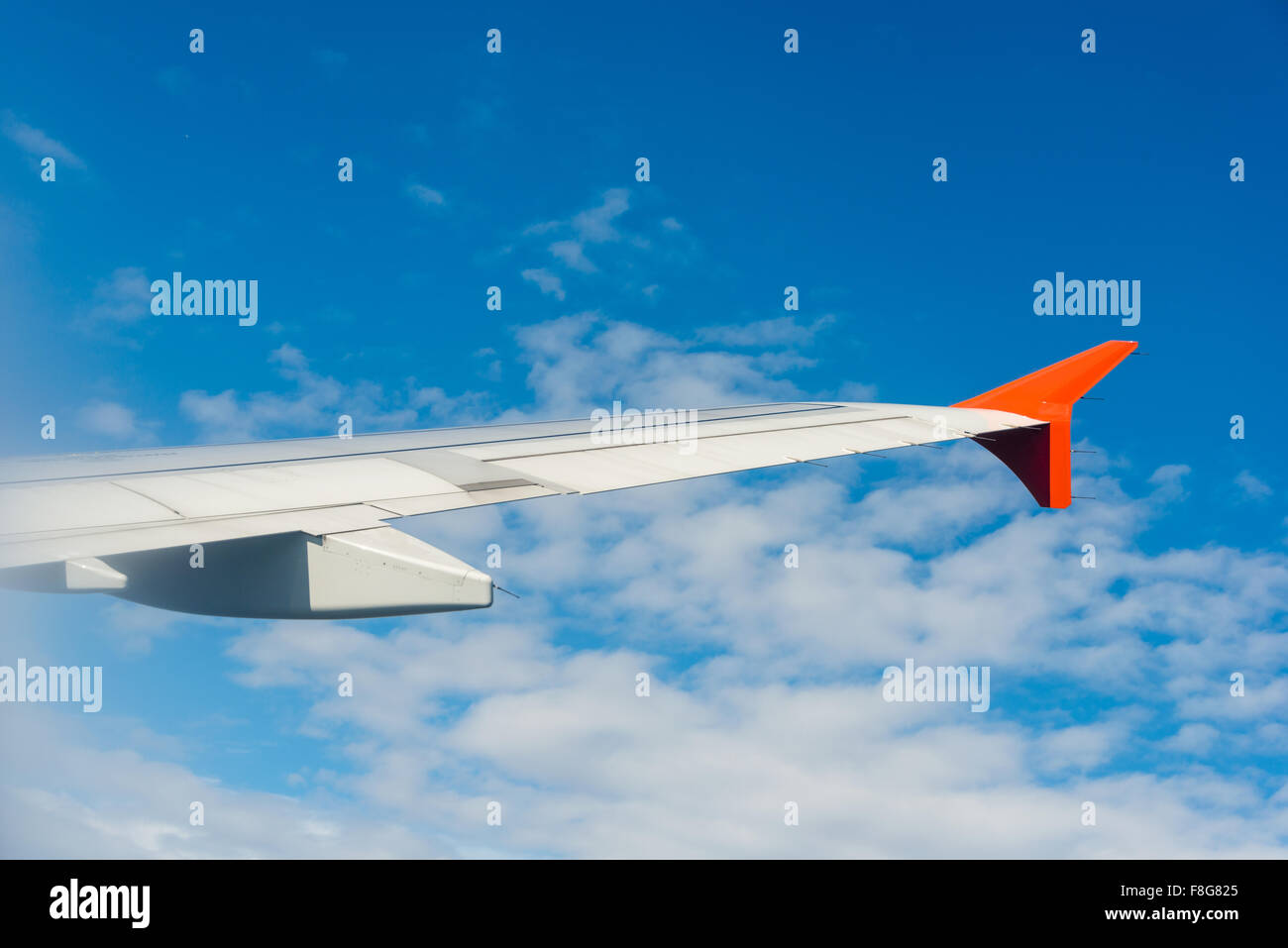 Airplane wing out of window Stock Photo - Alamy