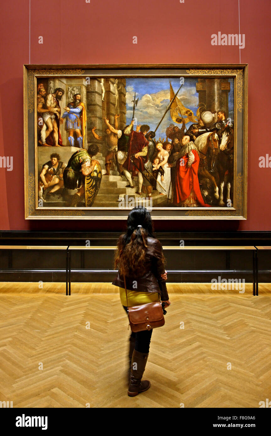Visitor admiring a painting by Titian in the Art History Museum ...