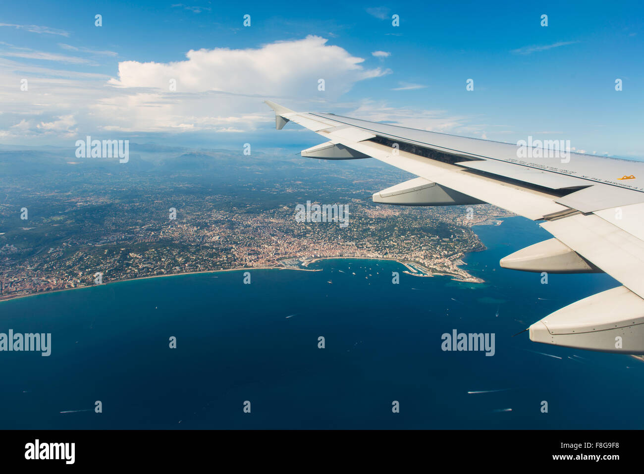 Airplane wing out of window Stock Photo - Alamy