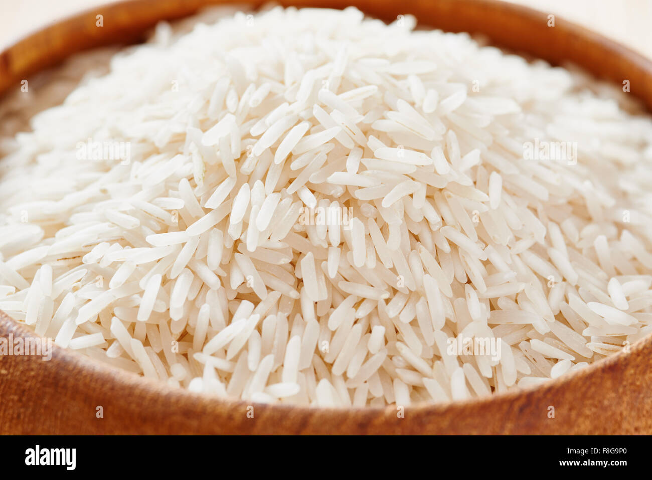 Basmati rice in bowl isolated closeup Stock Photo - Alamy