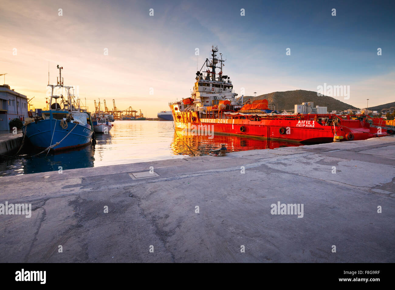 Fishing boats and a supply vessel at the central fish market in Piraeus ...