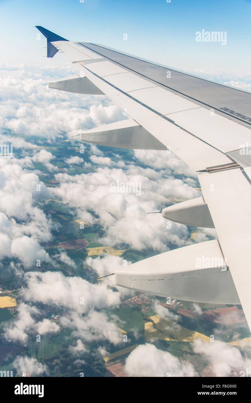 Airplane wing out of window Stock Photo - Alamy