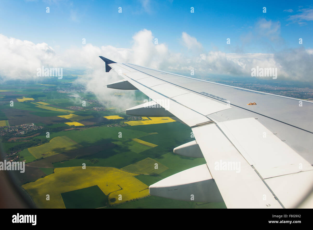 Airplane wing out of window Stock Photo - Alamy