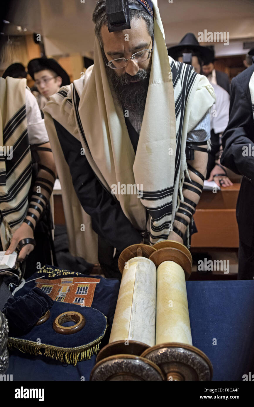 A religious Jewish man blessing the Torah at morning services at a ...