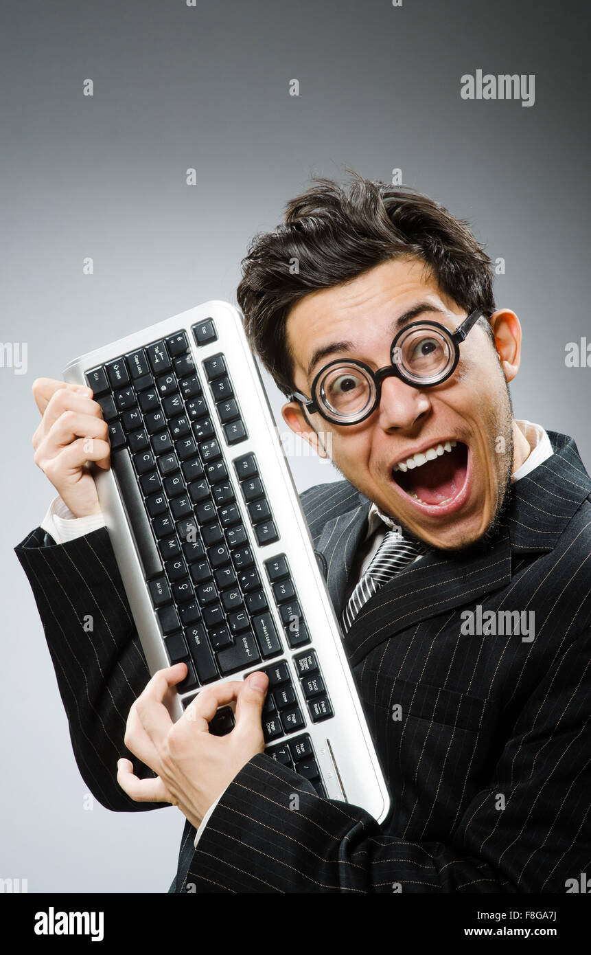 Comouter geek with computer keyboard Stock Photo - Alamy