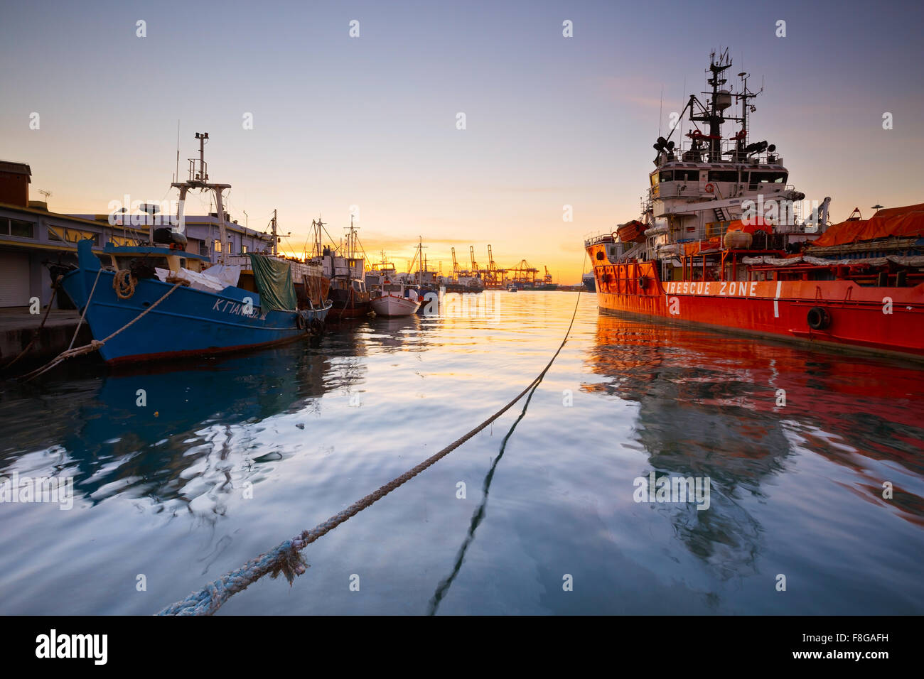 Fishing boats and a supply vessel at the central fish market in Piraeus ...