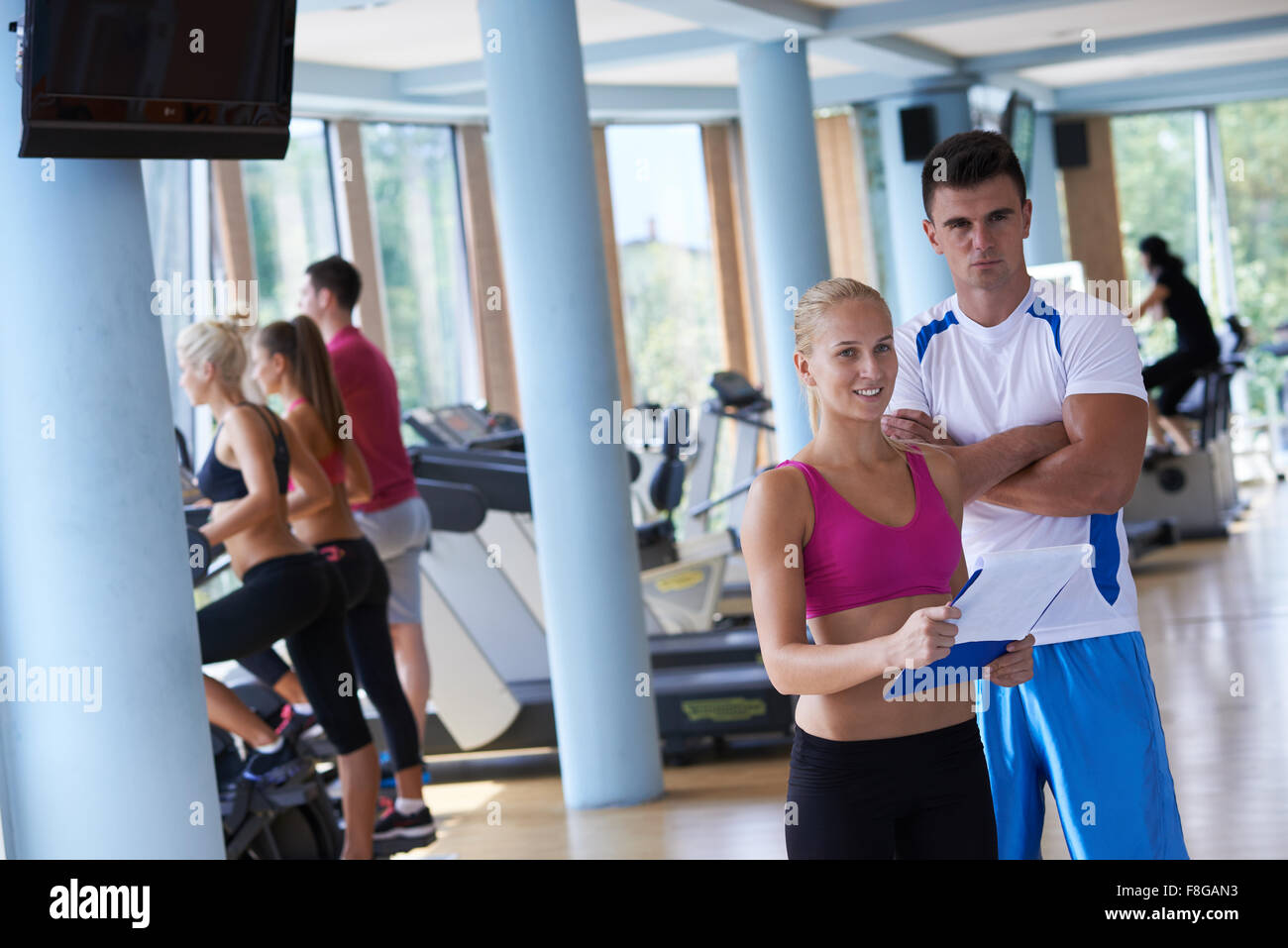 group portrait of healthy and fit young people in fitness gym Stock ...