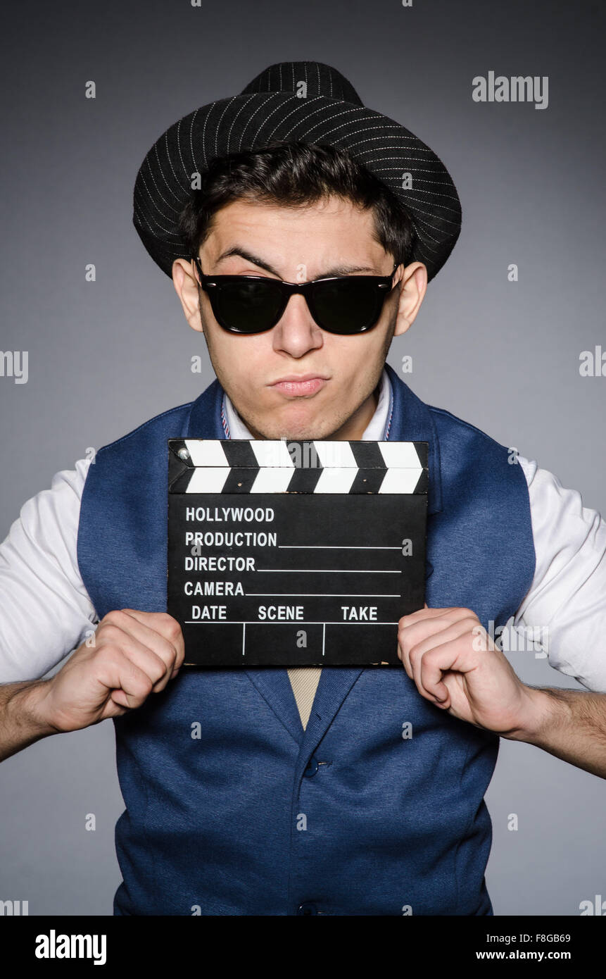 Funny man with movie clapper Stock Photo - Alamy