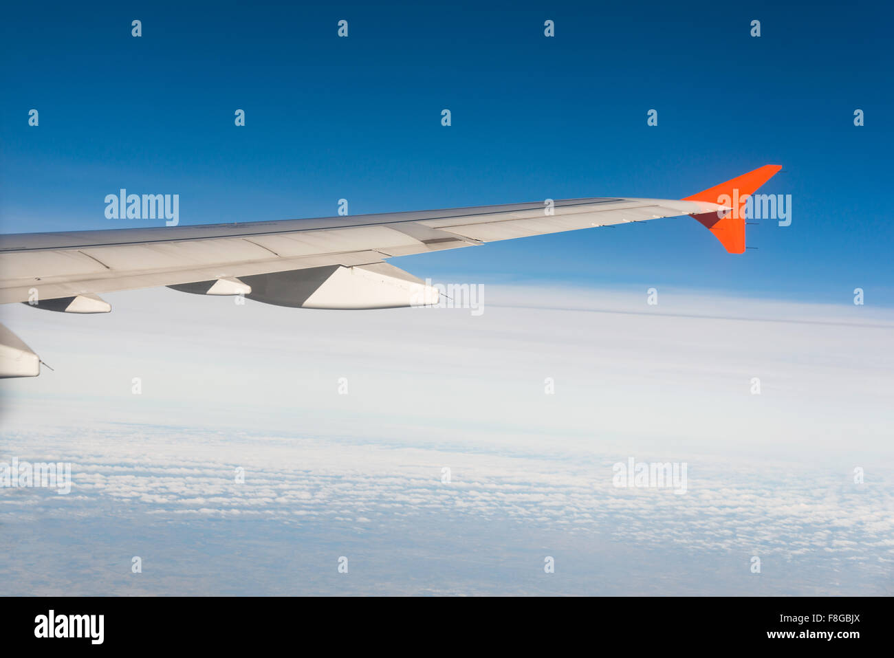 Airplane wing out of window Stock Photo - Alamy